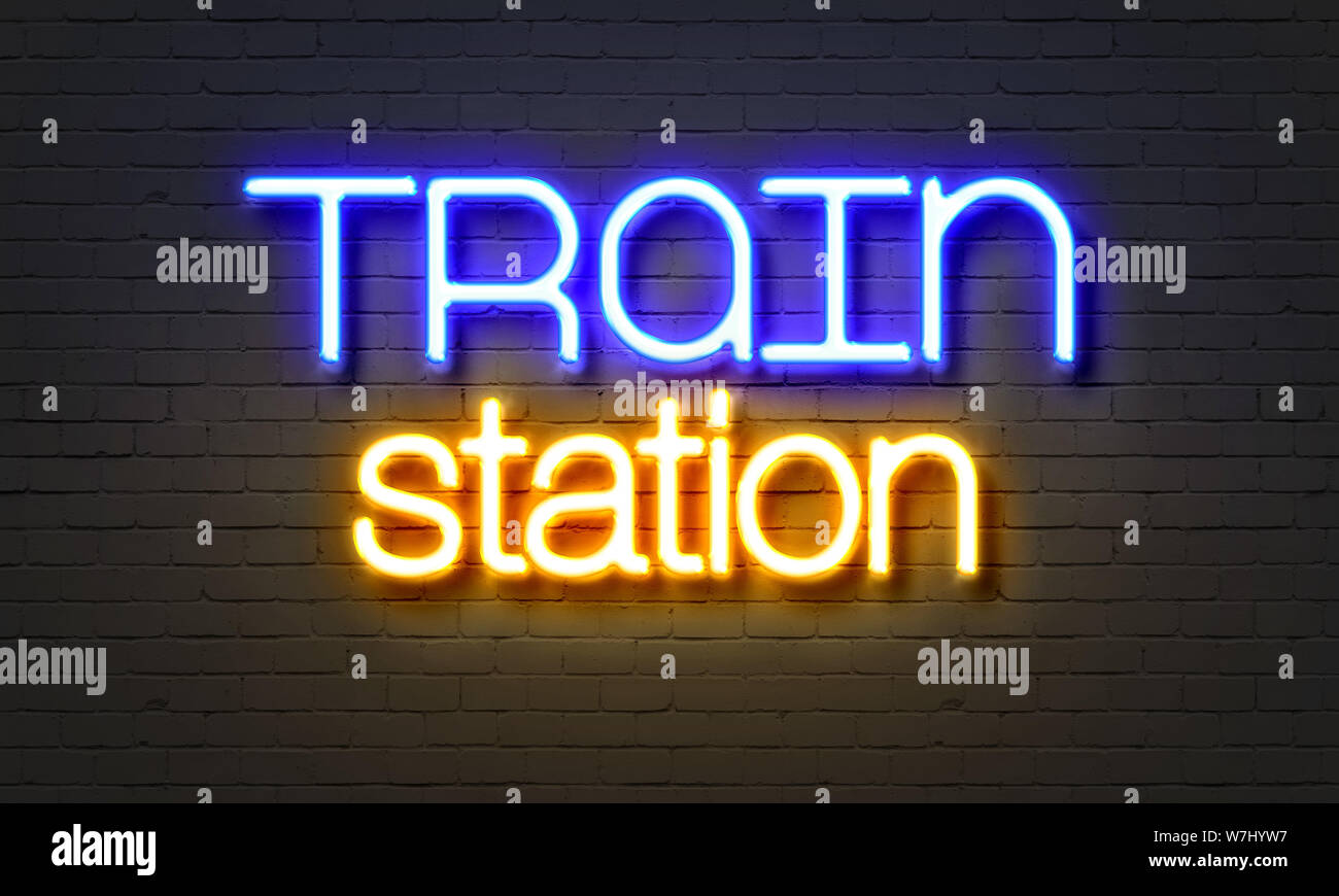Train station neon sign on brick wall background Stock Photo - Alamy