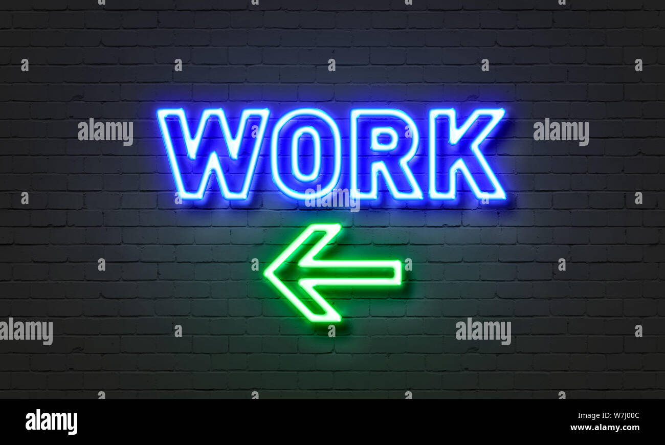 Work neon sign on brick wall background Stock Photo - Alamy