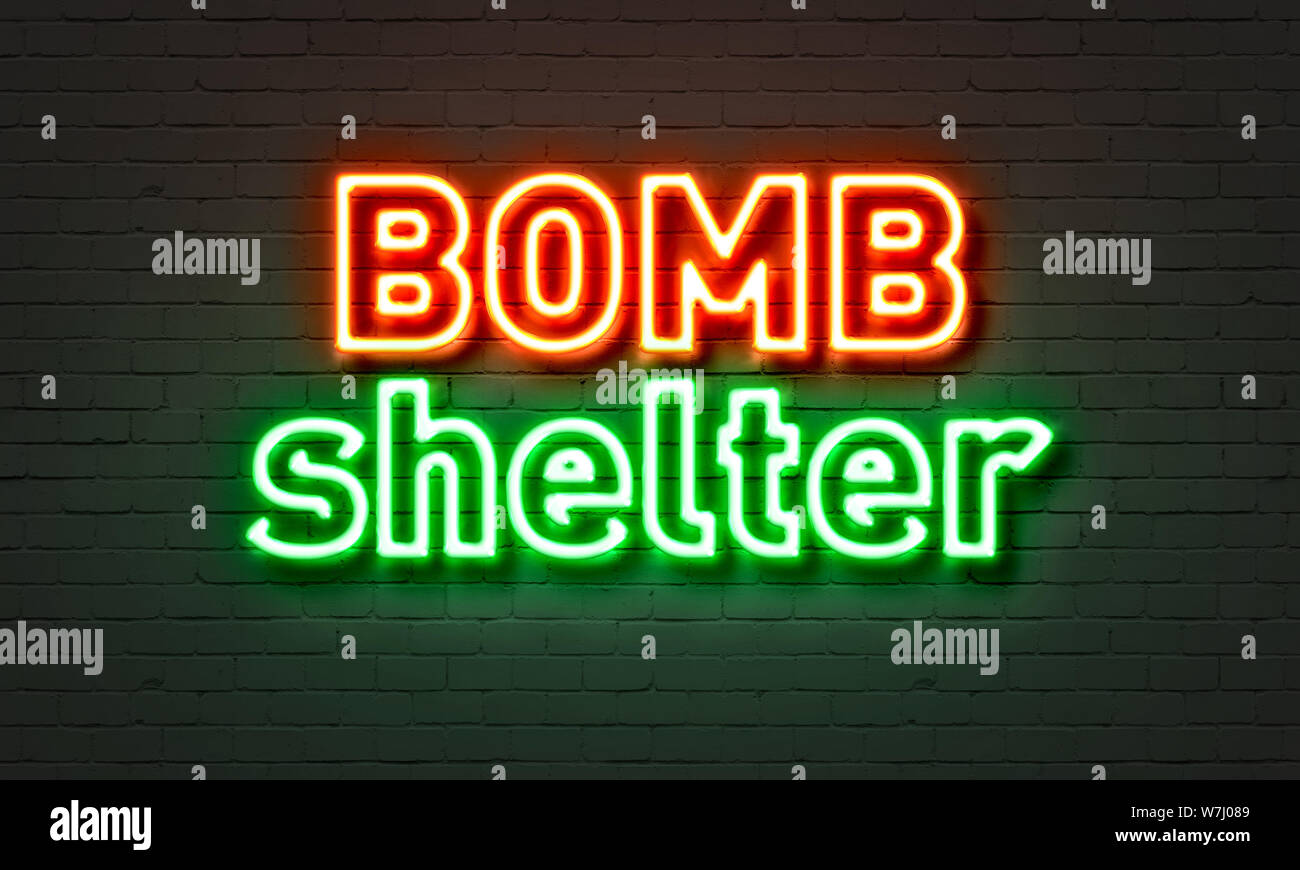 Bomb shelter neon sign on brick wall background Stock Photo - Alamy