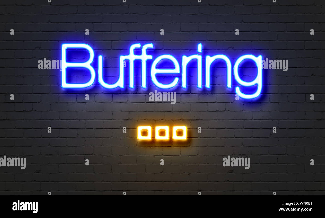 Buffering neon sign on brick wall background Stock Photo - Alamy