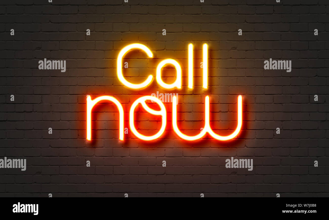 Call now neon sign on brick wall background Stock Photo - Alamy