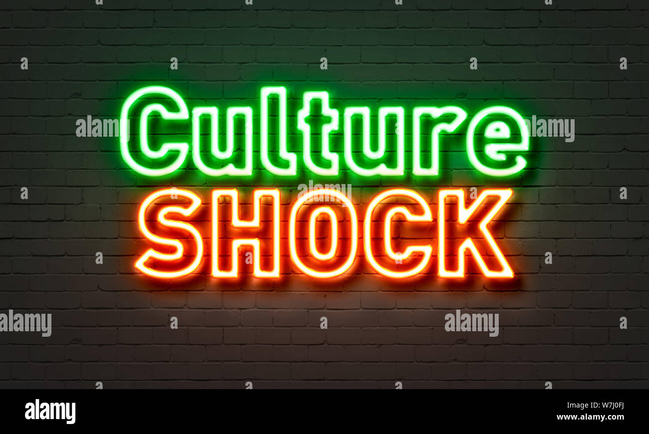 Culture shock neon sign on brick wall background Stock Photo - Alamy