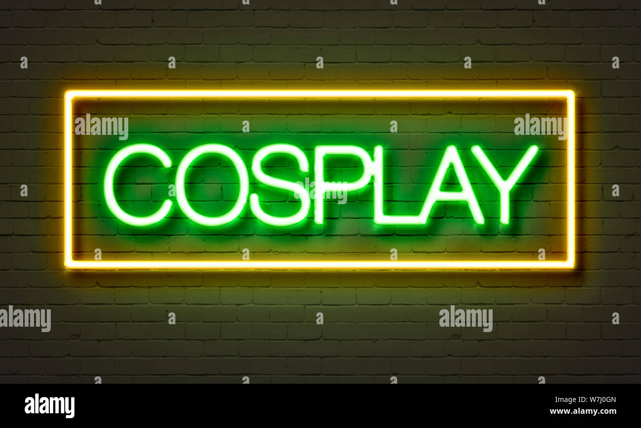 Cosplay neon sign on brick wall background Stock Photo - Alamy