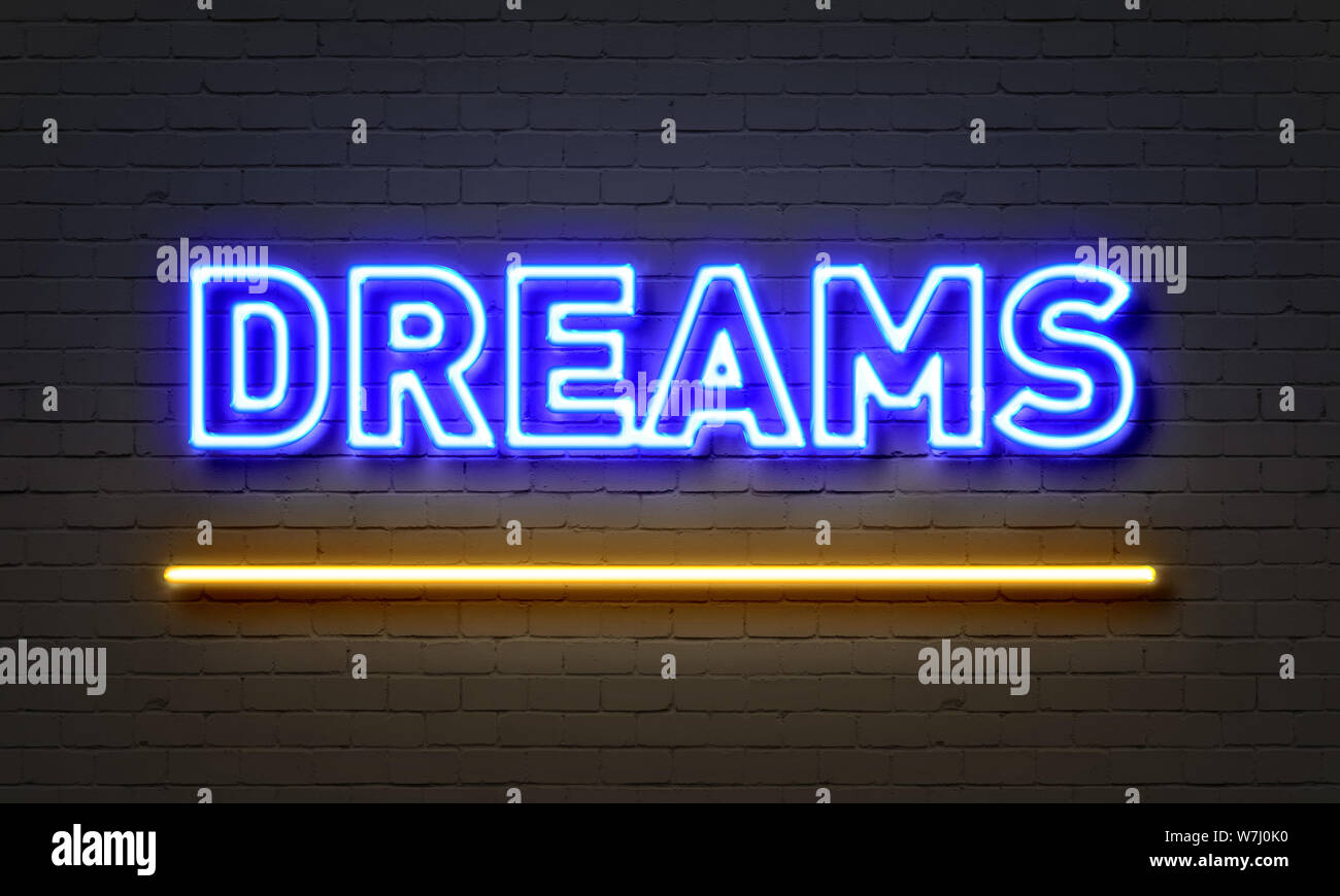 Dreams neon sign on brick wall background Stock Photo - Alamy