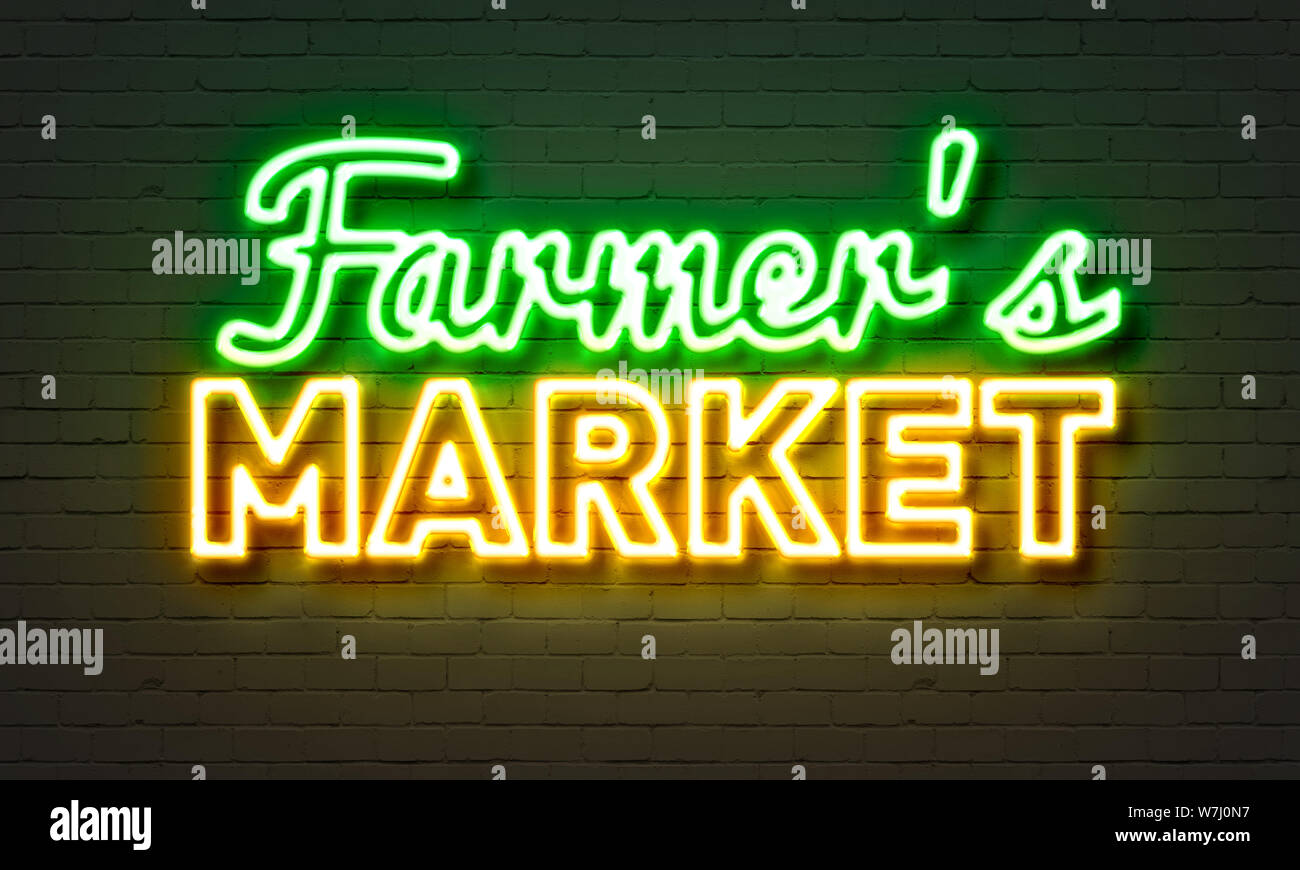 Farmers market neon sign on brick wall background Stock Photo - Alamy