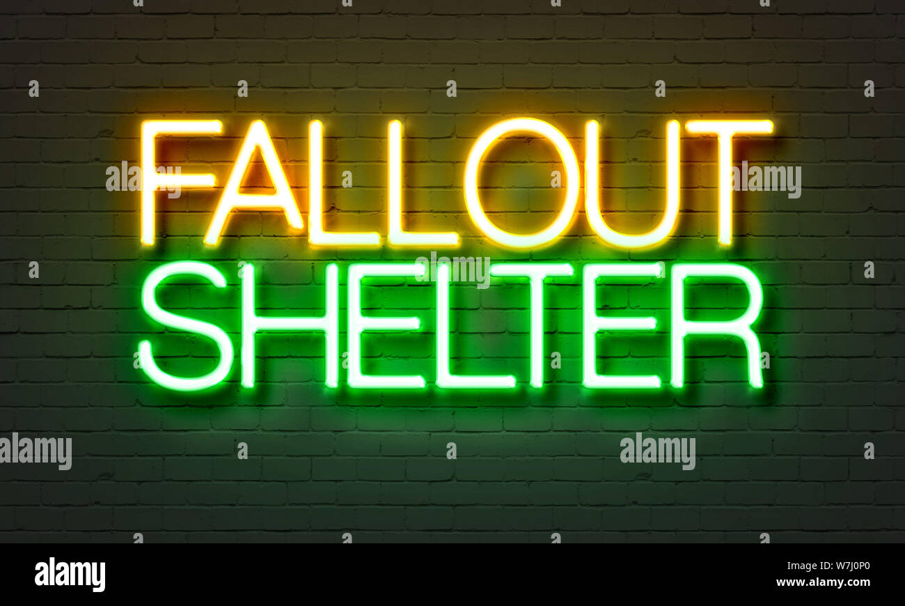 Fallout shelter neon sign on brick wall background Stock Photo - Alamy