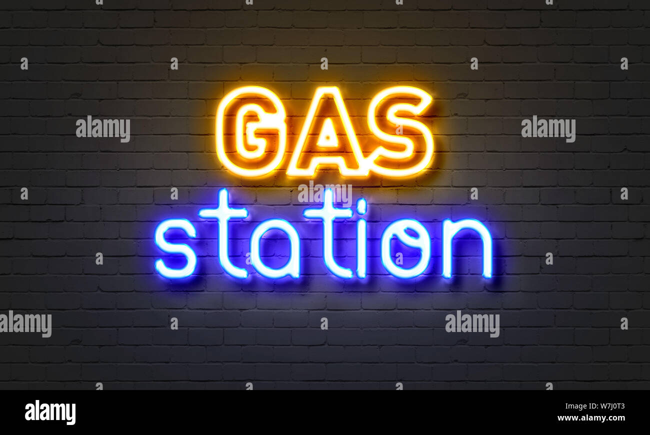 Gas station neon sign on brick wall background Stock Photo - Alamy