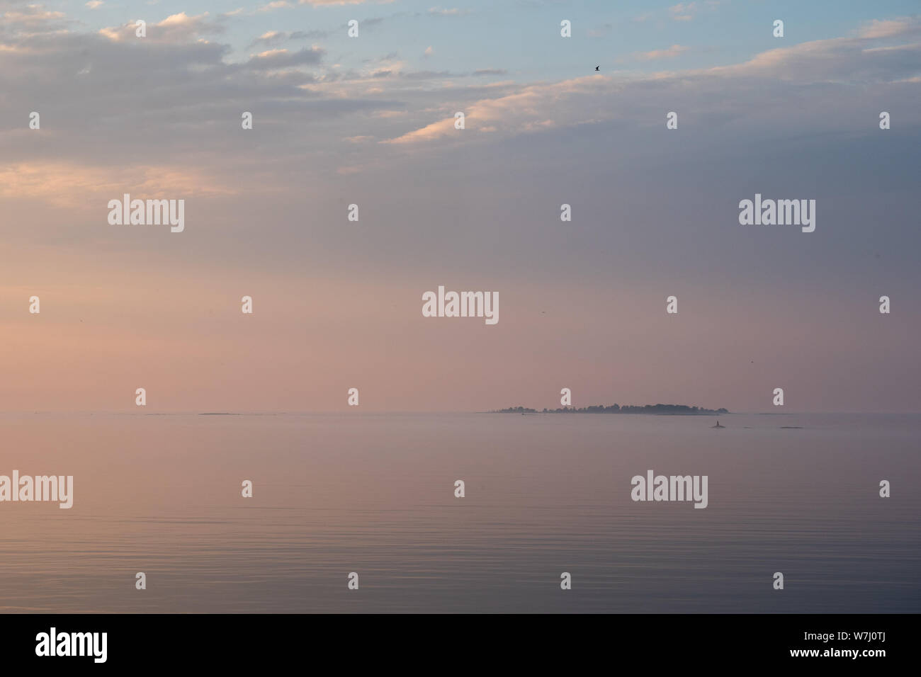 quiet mood on the sea with island Stock Photo - Alamy