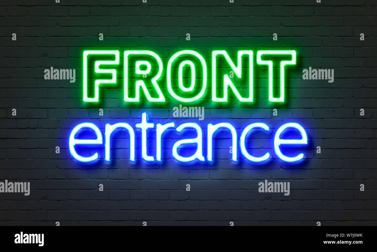 Front entrance neon sign on brick wall background Stock Photo - Alamy