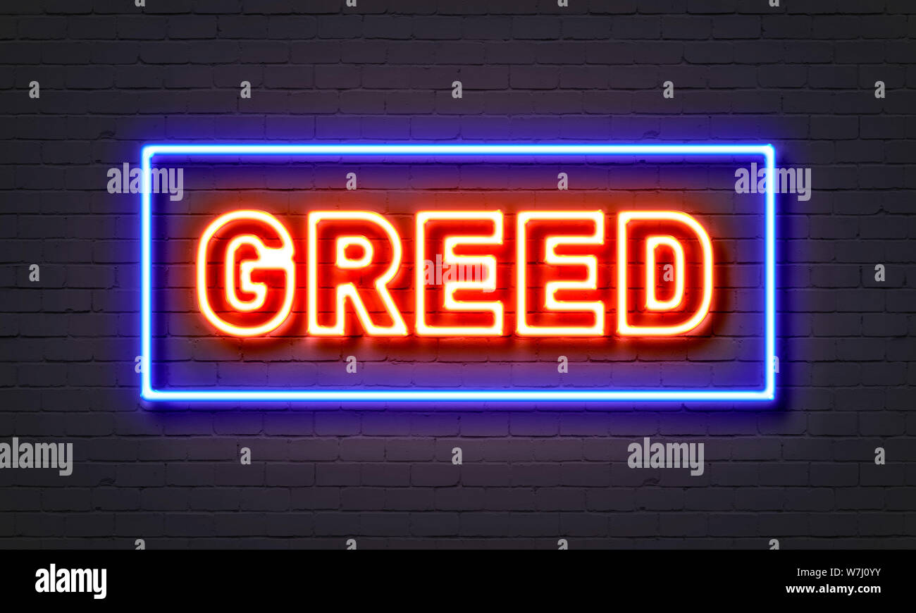 Greed neon sign on brick wall background Stock Photo - Alamy