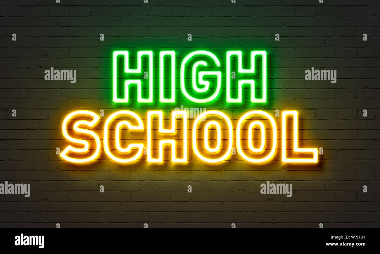 High school neon sign on brick wall background Stock Photo - Alamy