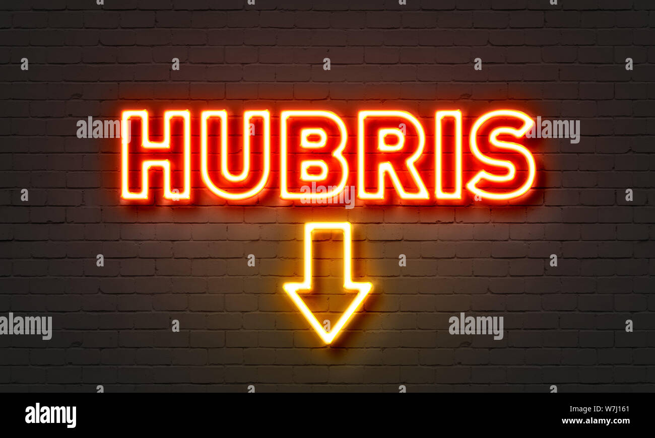 Hubris neon sign on brick wall background Stock Photo - Alamy