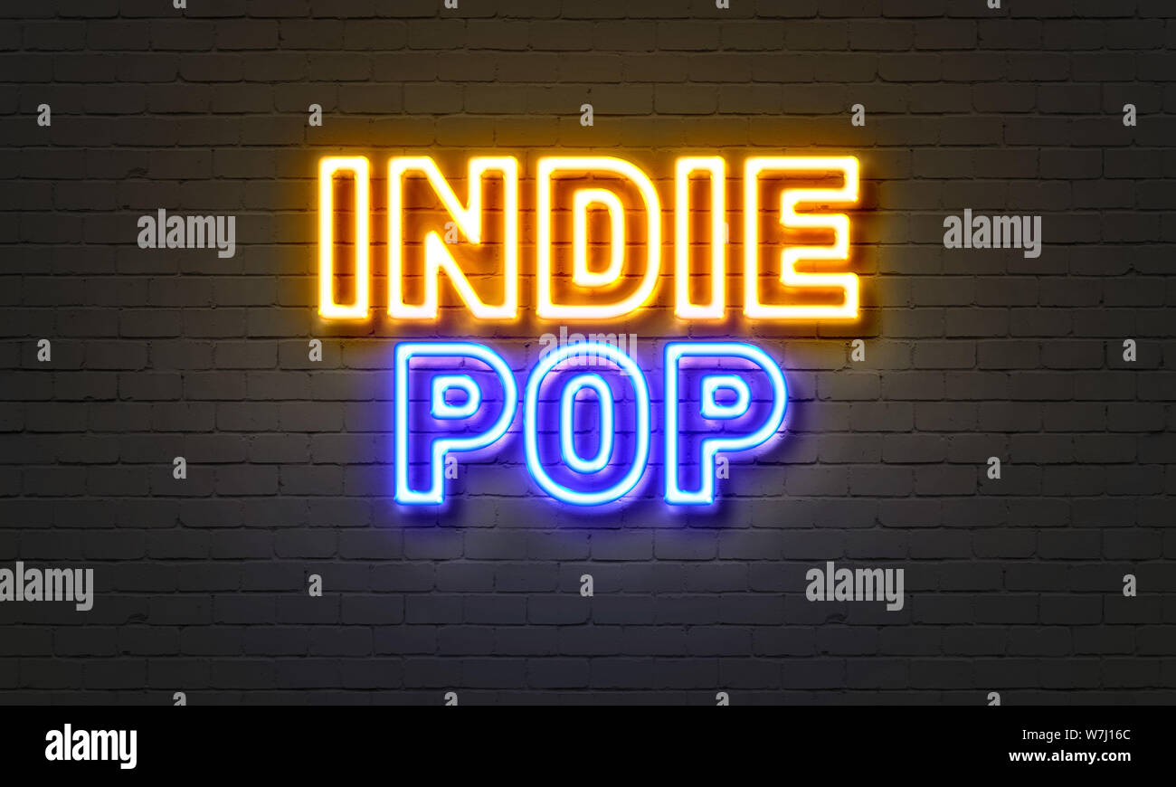 Indie pop neon sign on brick wall background Stock Photo - Alamy
