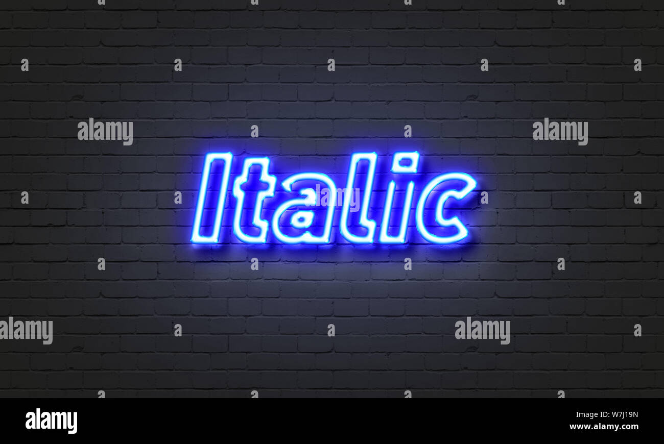 Italic neon sign on brick wall background Stock Photo - Alamy