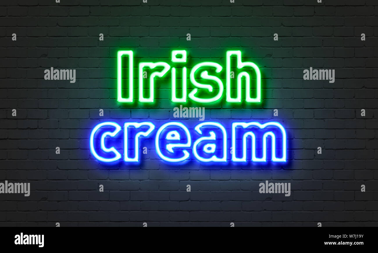 Irish cream neon sign on brick wall background Stock Photo - Alamy