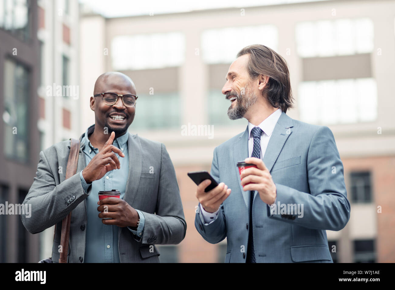 Grey haired businessman holding hi-res stock photography and images - Alamy