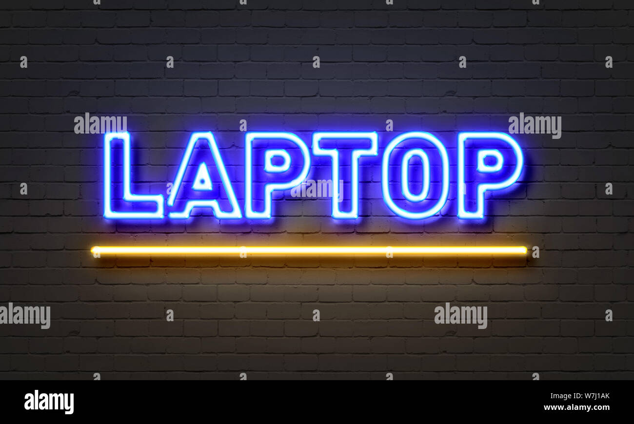 Laptop neon sign on brick wall background Stock Photo - Alamy