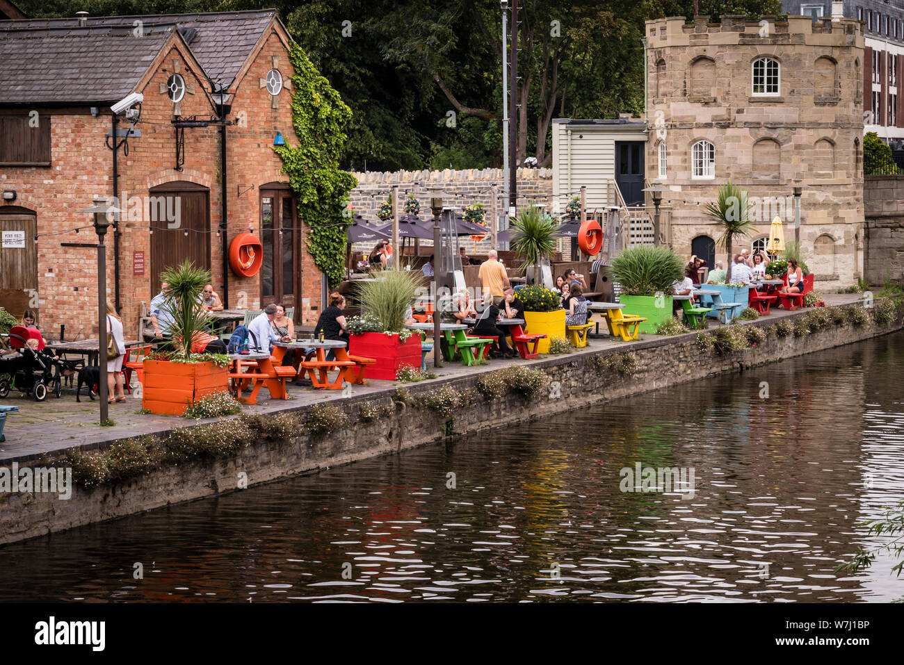 Cafes and restaurants: outside dining by the river at Cox's Yard with ...