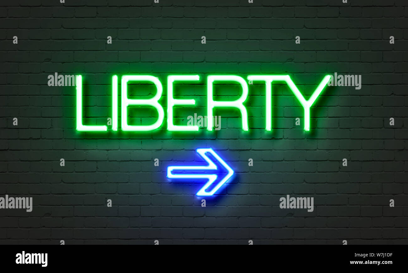 Liberty neon sign on brick wall background Stock Photo - Alamy