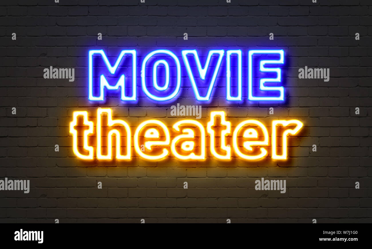 Movie theater neon sign on brick wall background Stock Photo - Alamy