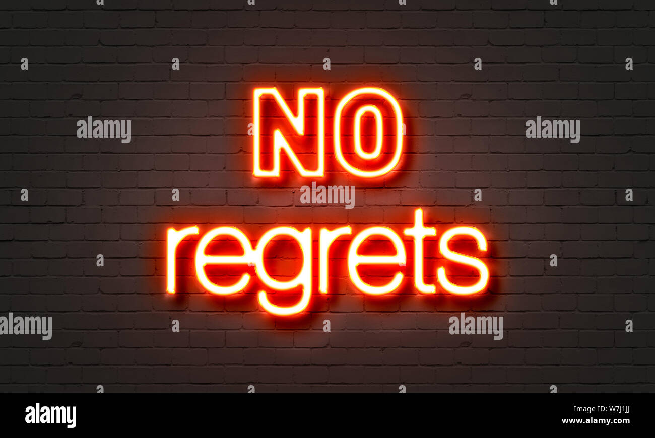 No regrets neon sign on brick wall background Stock Photo - Alamy