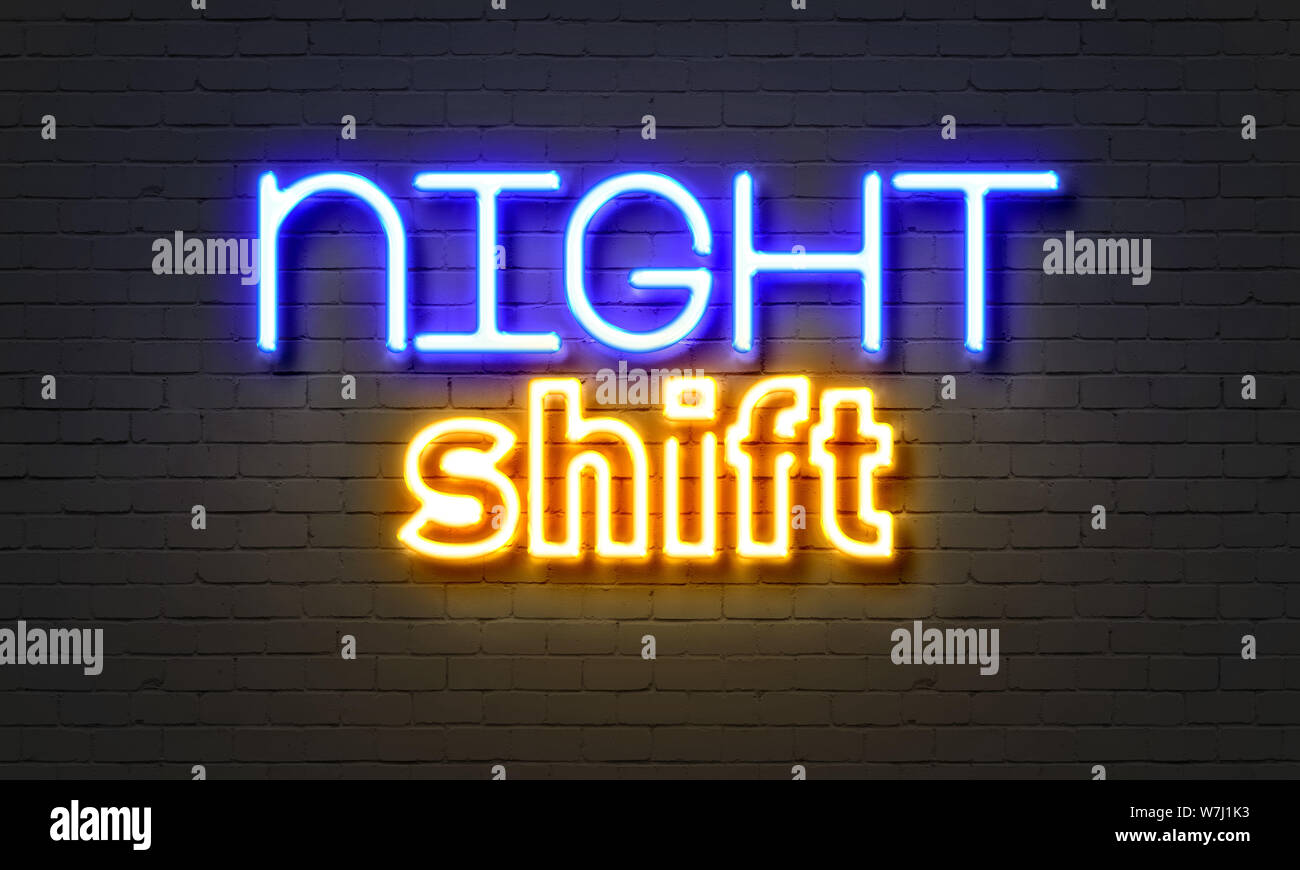 Night shift neon sign on brick wall background Stock Photo - Alamy