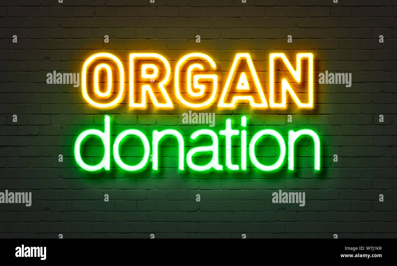 Organ donation neon sign on brick wall background Stock Photo - Alamy