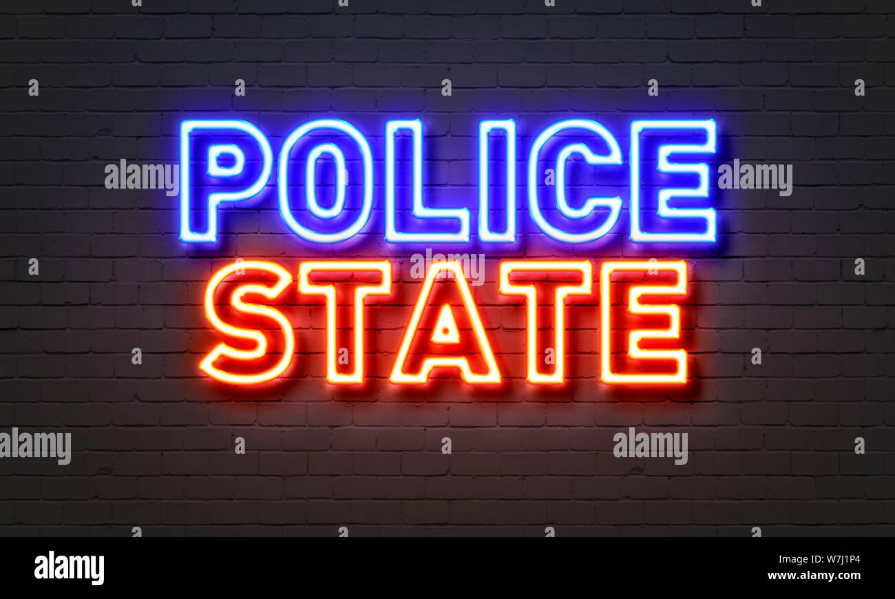 Police state neon sign on brick wall background Stock Photo - Alamy