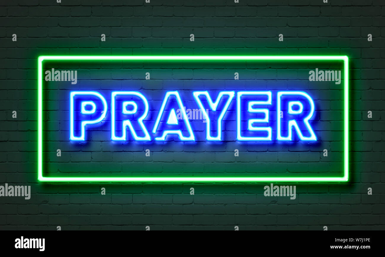 Prayer neon sign on brick wall background Stock Photo - Alamy