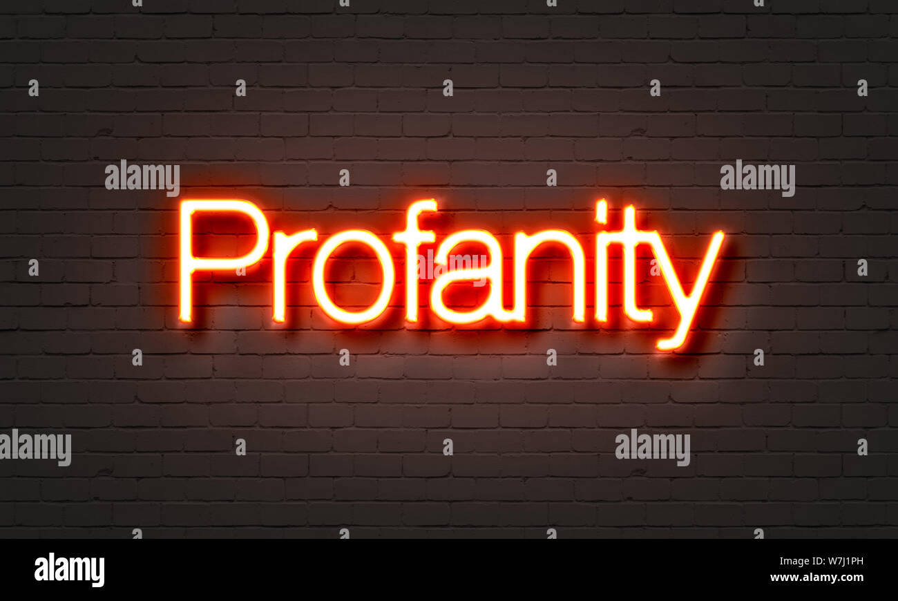 Profanity neon sign on brick wall background Stock Photo - Alamy