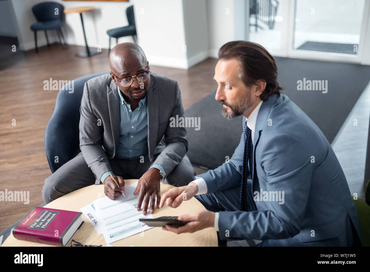 Economist employee hi-res stock photography and images - Alamy