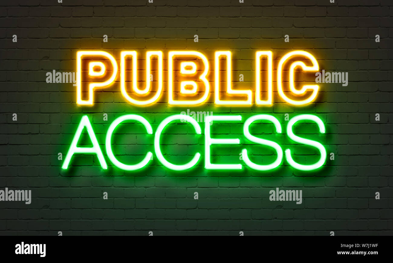 Public access neon sign on brick wall background Stock Photo - Alamy