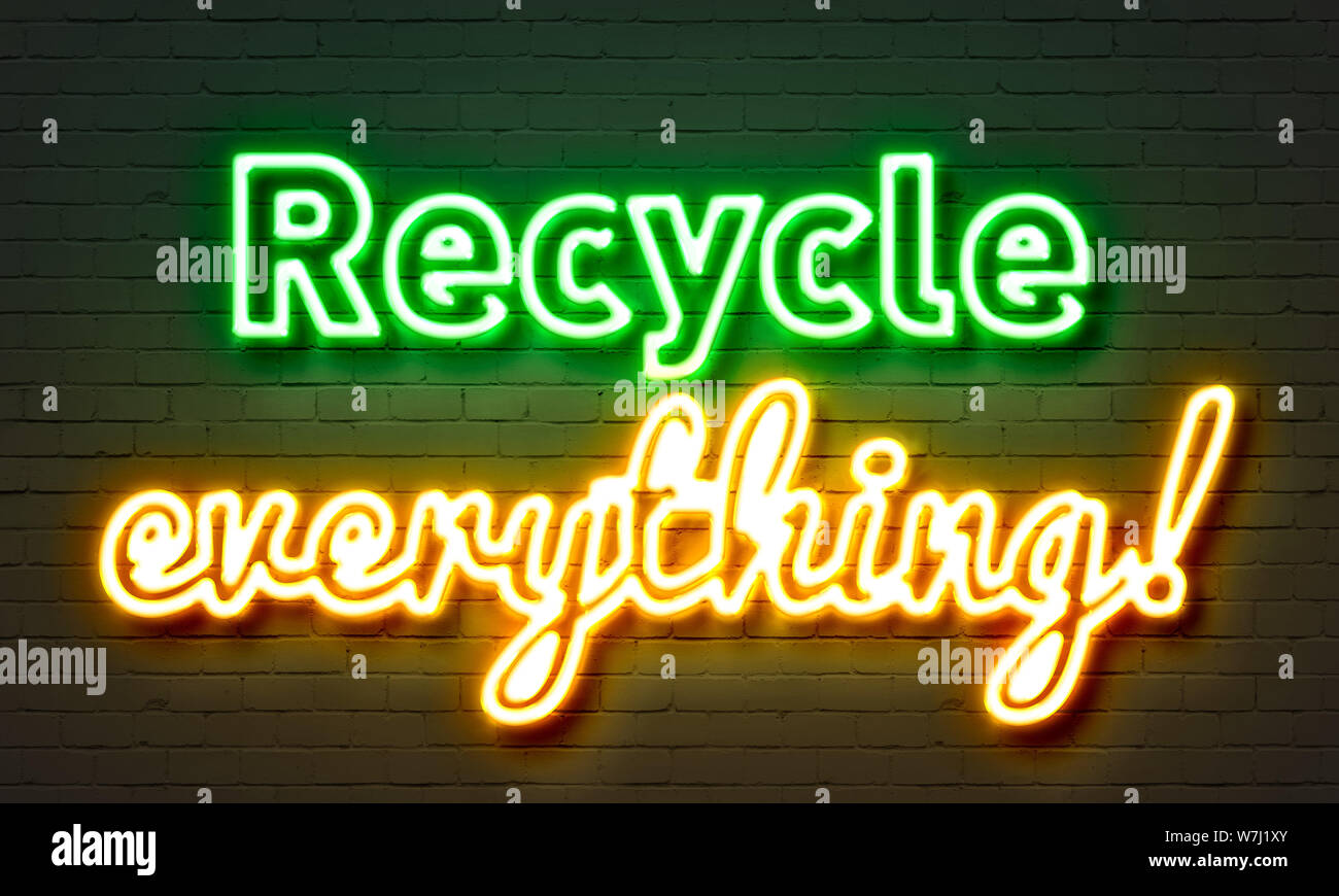 Recycle everything neon sign on brick wall background Stock Photo - Alamy