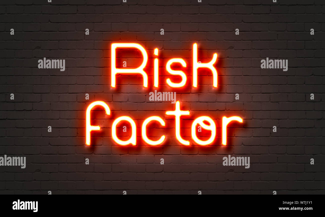 Risk factor neon sign on brick wall background Stock Photo - Alamy