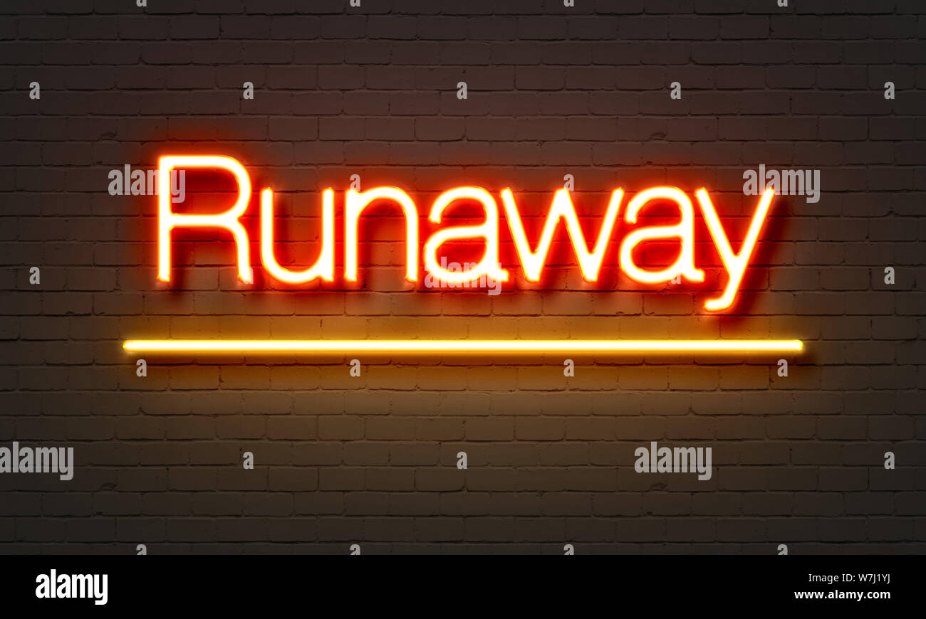 Runaway neon sign on brick wall background Stock Photo - Alamy