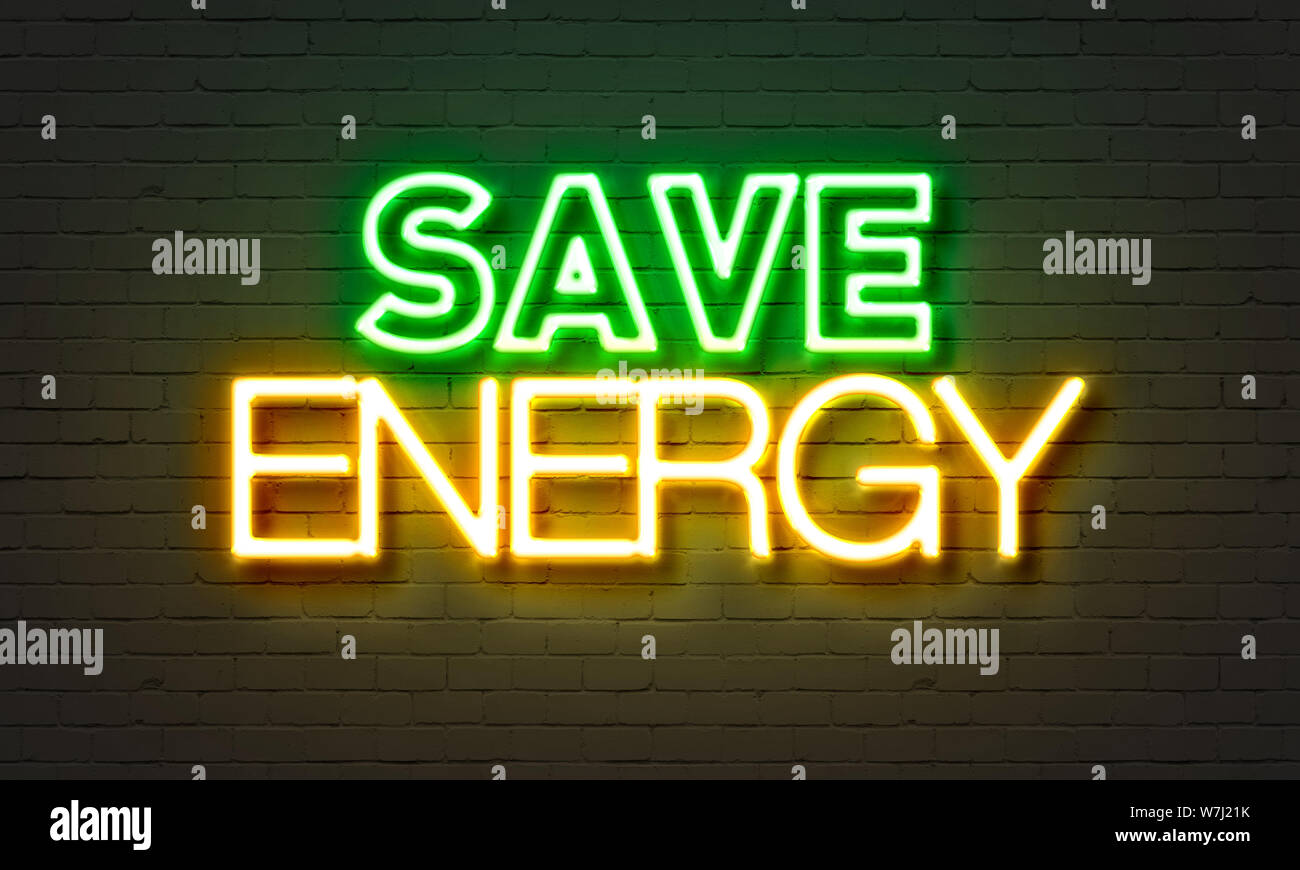 Save energy neon sign on brick wall background Stock Photo - Alamy