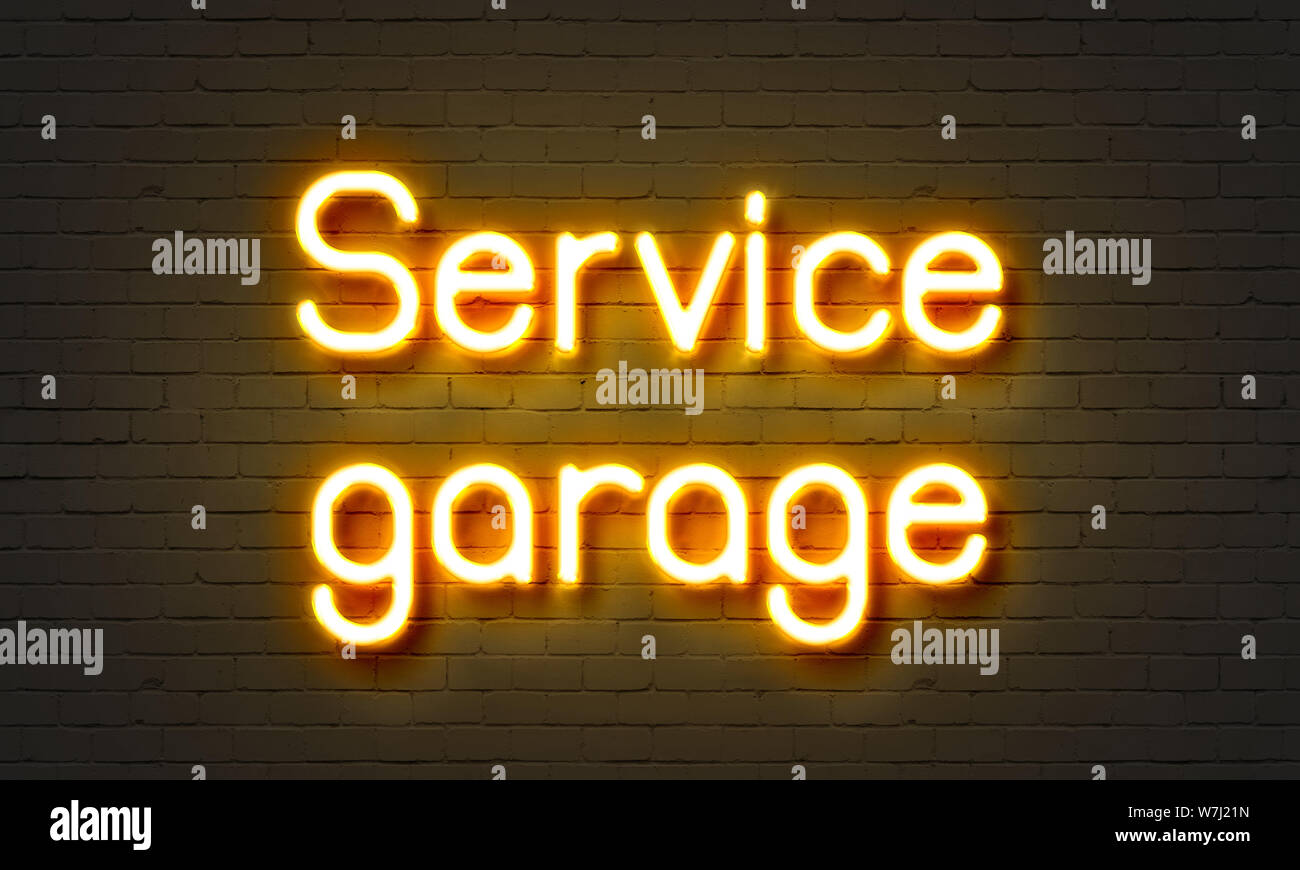 Service garage neon sign on brick wall background Stock Photo - Alamy
