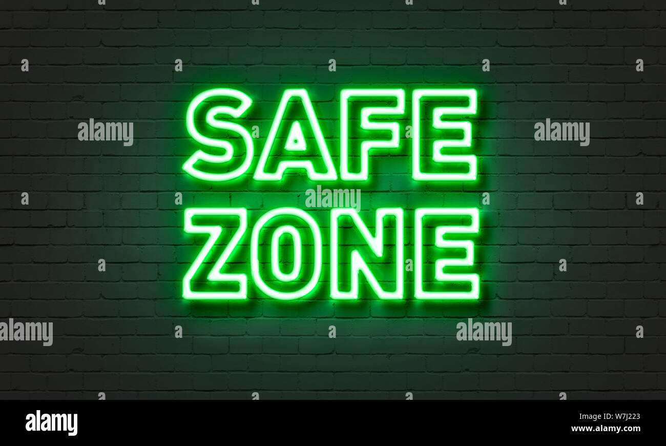 Safe zone neon sign on brick wall background Stock Photo - Alamy