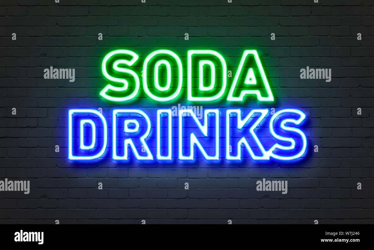 Soda drinks neon sign on brick wall background Stock Photo - Alamy