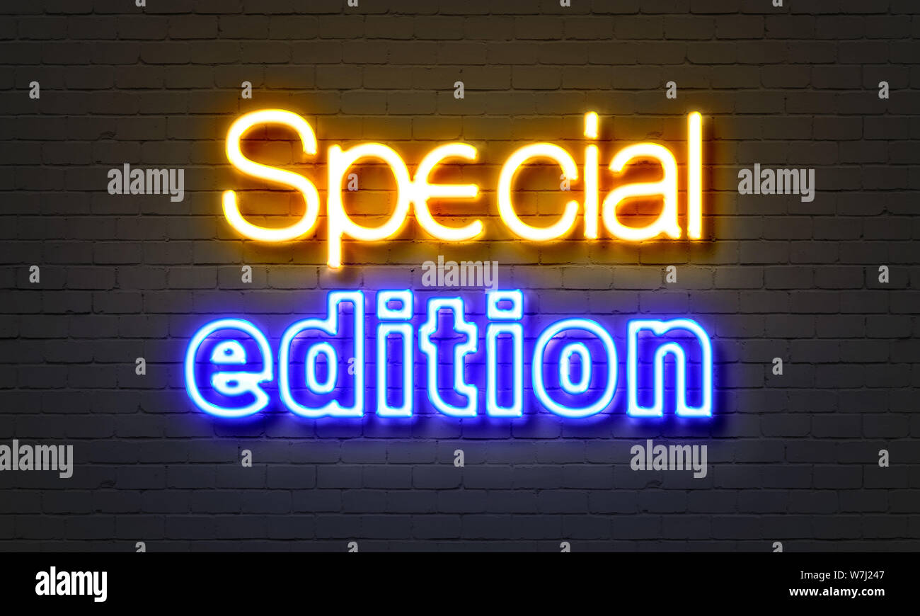 Special edition neon sign on brick wall background Stock Photo - Alamy