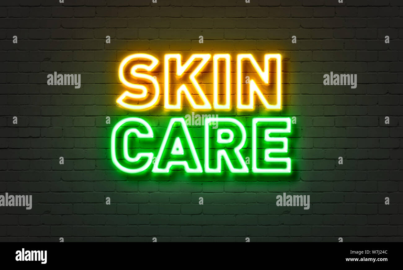 Skin care neon sign on brick wall background Stock Photo - Alamy