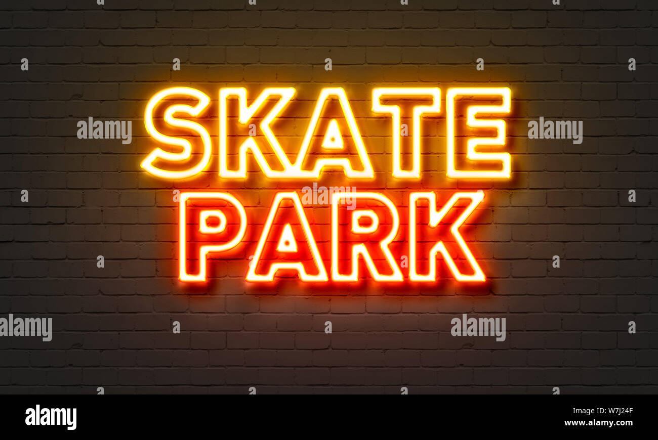 Skate park neon sign on brick wall background Stock Photo - Alamy