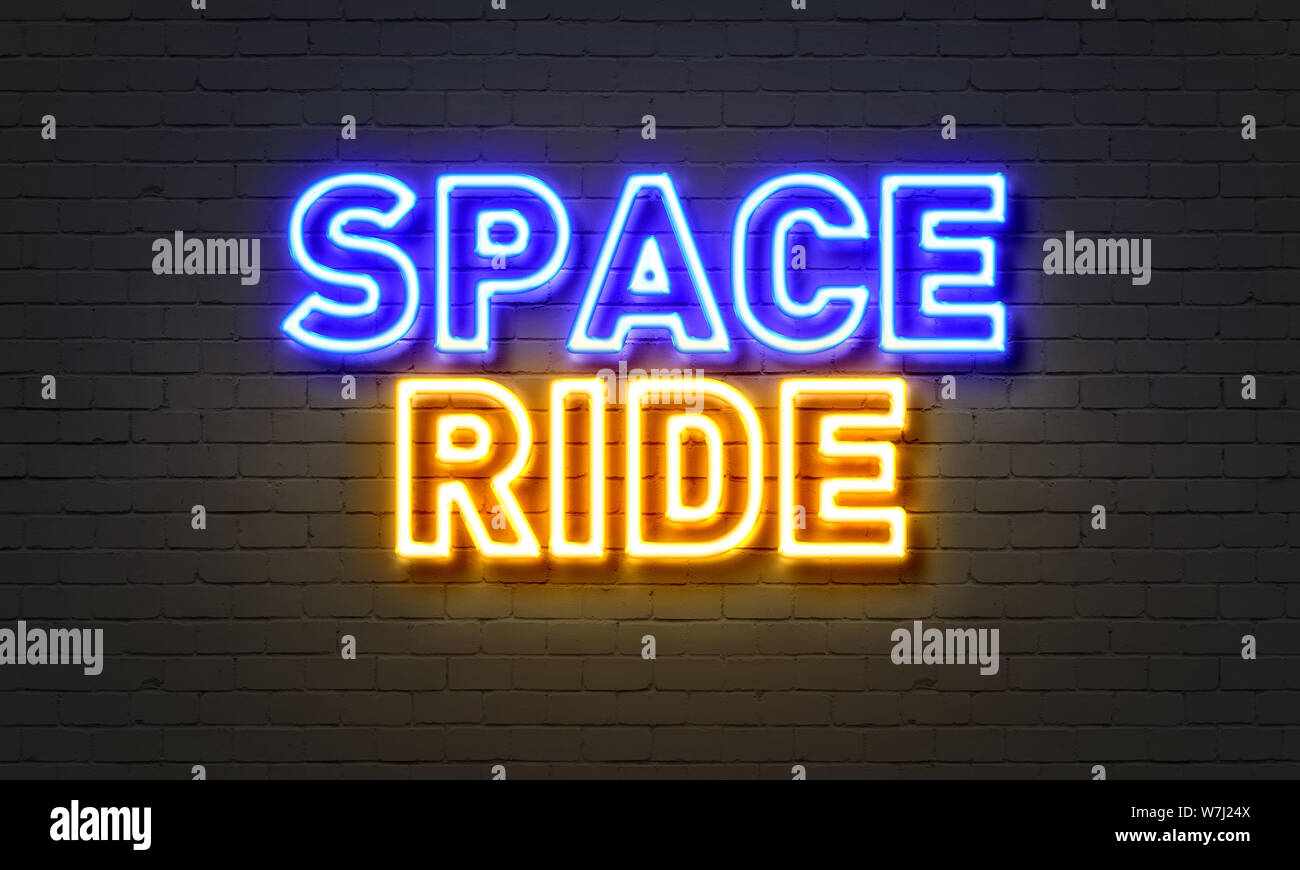 Space ride neon sign on brick wall background Stock Photo - Alamy