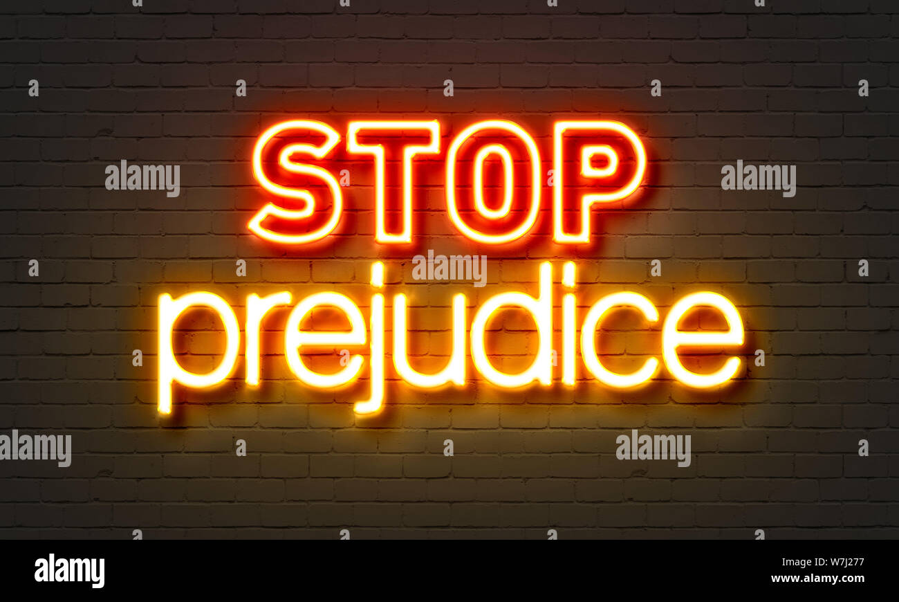 Stop prejudice neon sign on brick wall background Stock Photo - Alamy