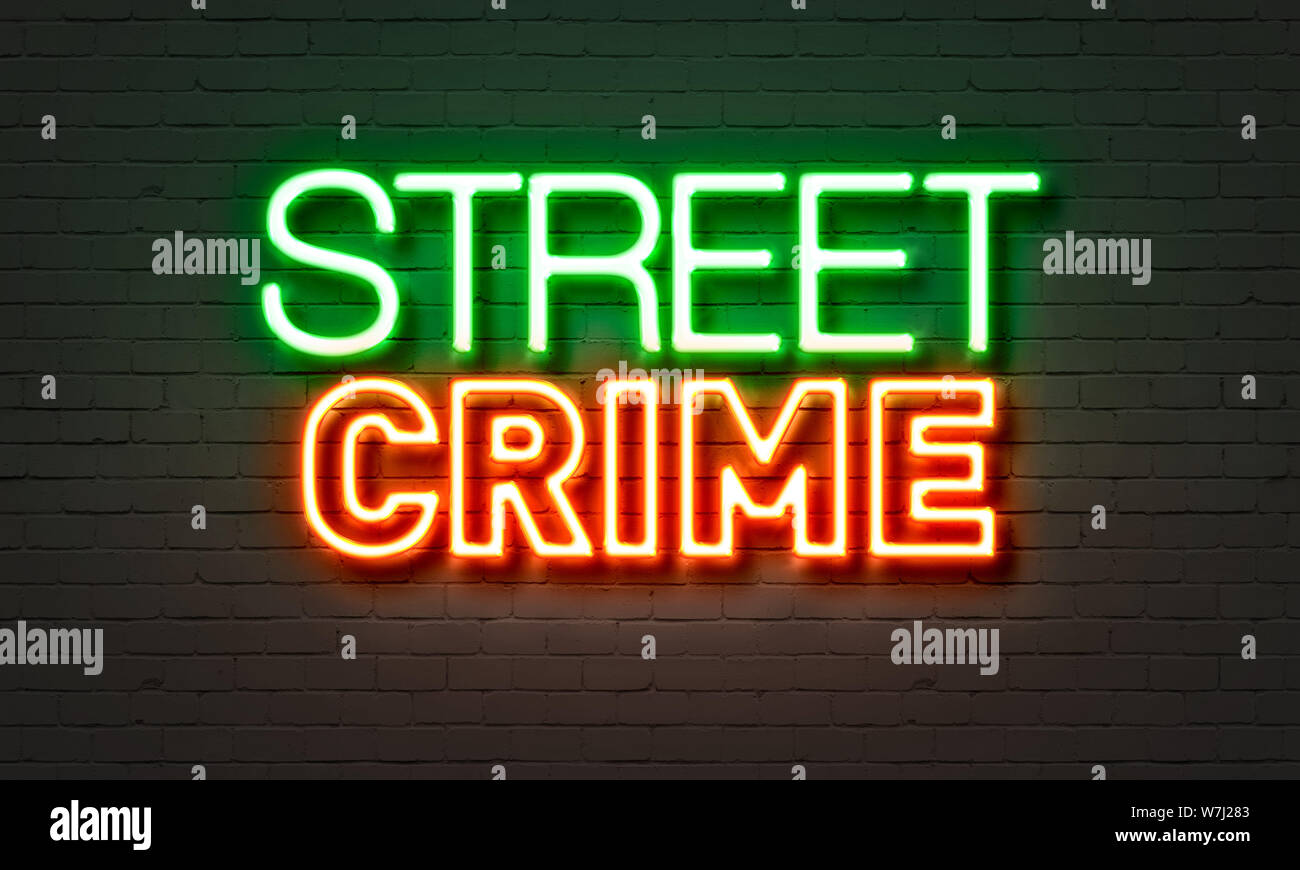 Street crime neon sign on brick wall background Stock Photo - Alamy