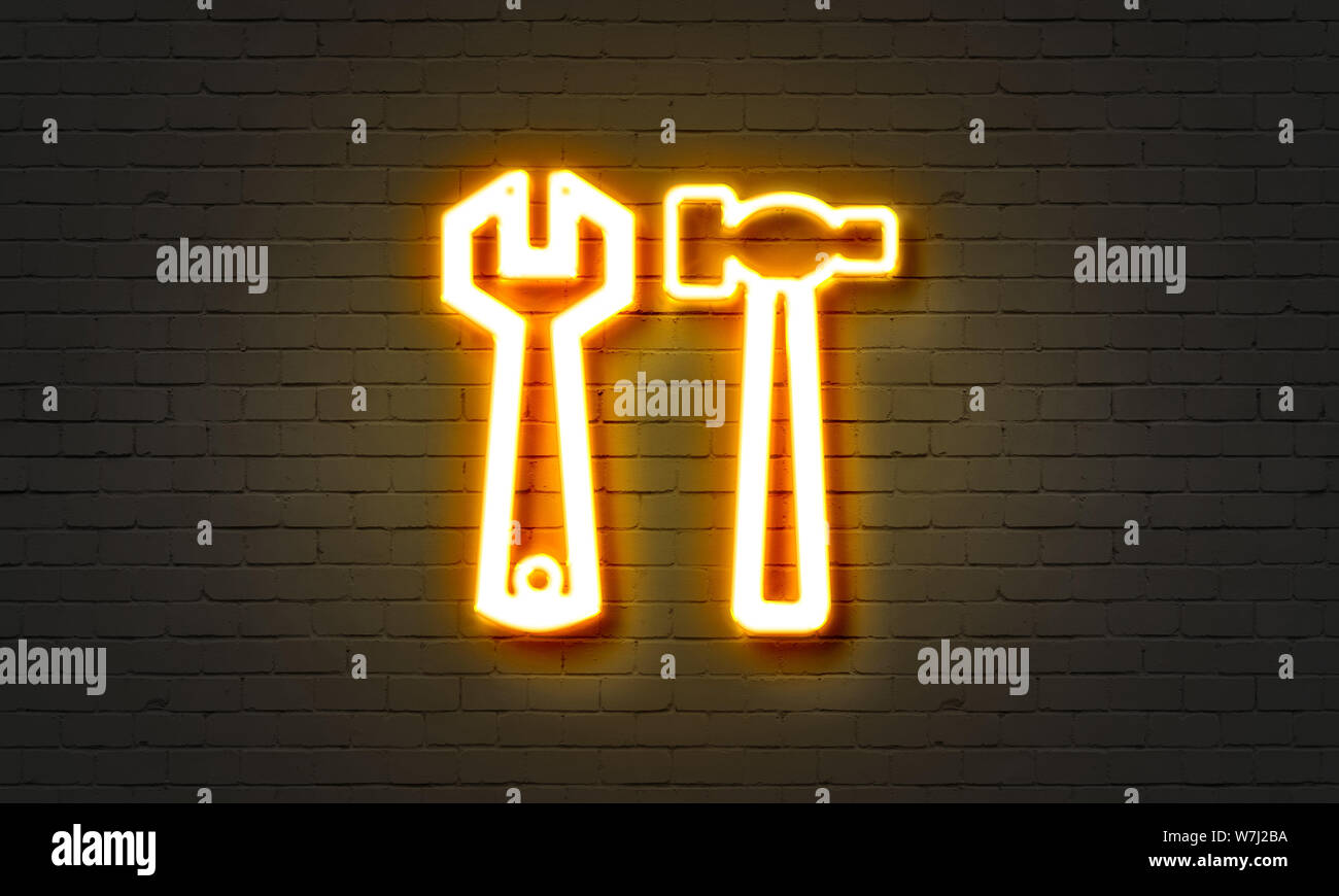 Tools neon sign on brick wall background Stock Photo - Alamy
