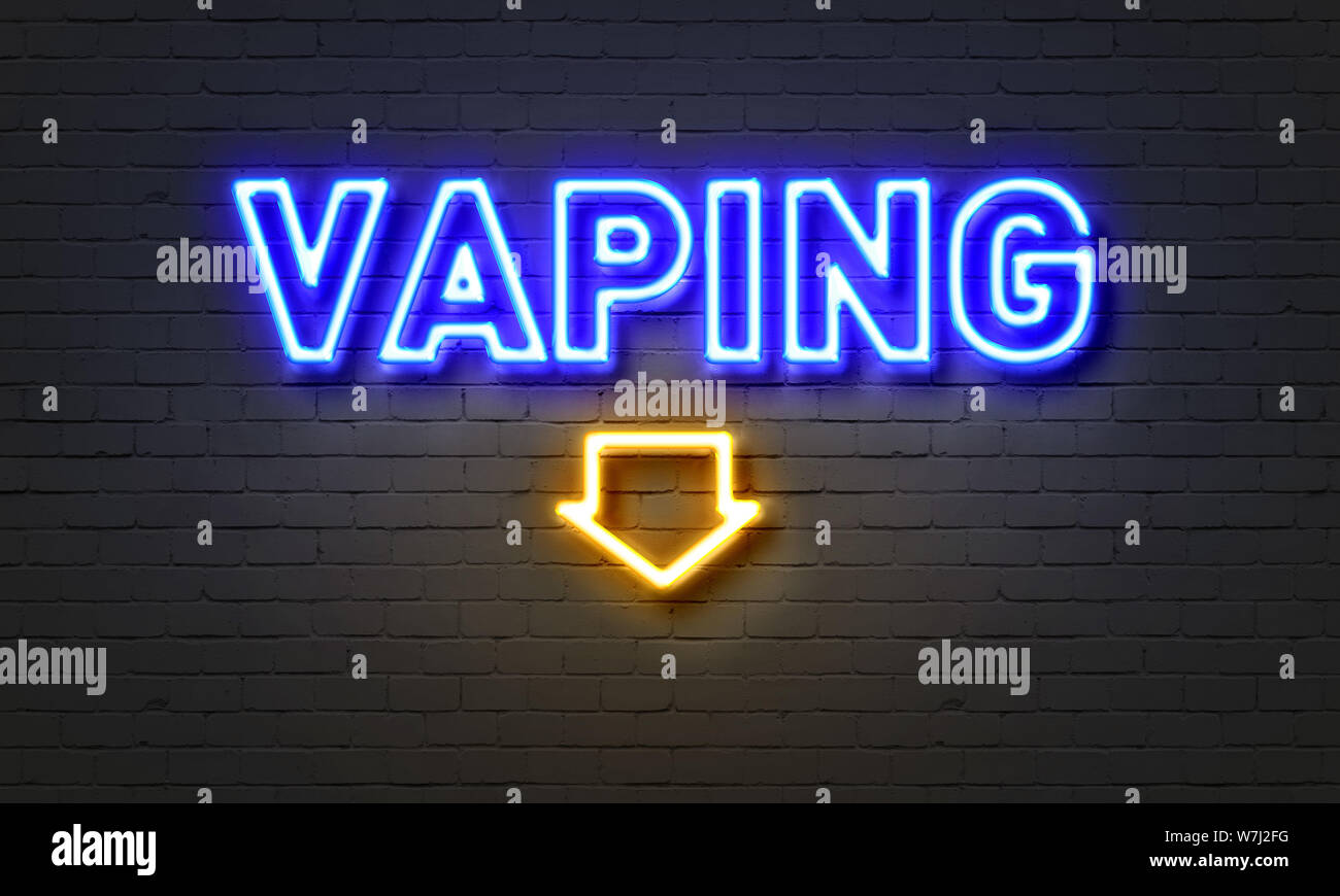 Vaping neon sign on brick wall background Stock Photo - Alamy