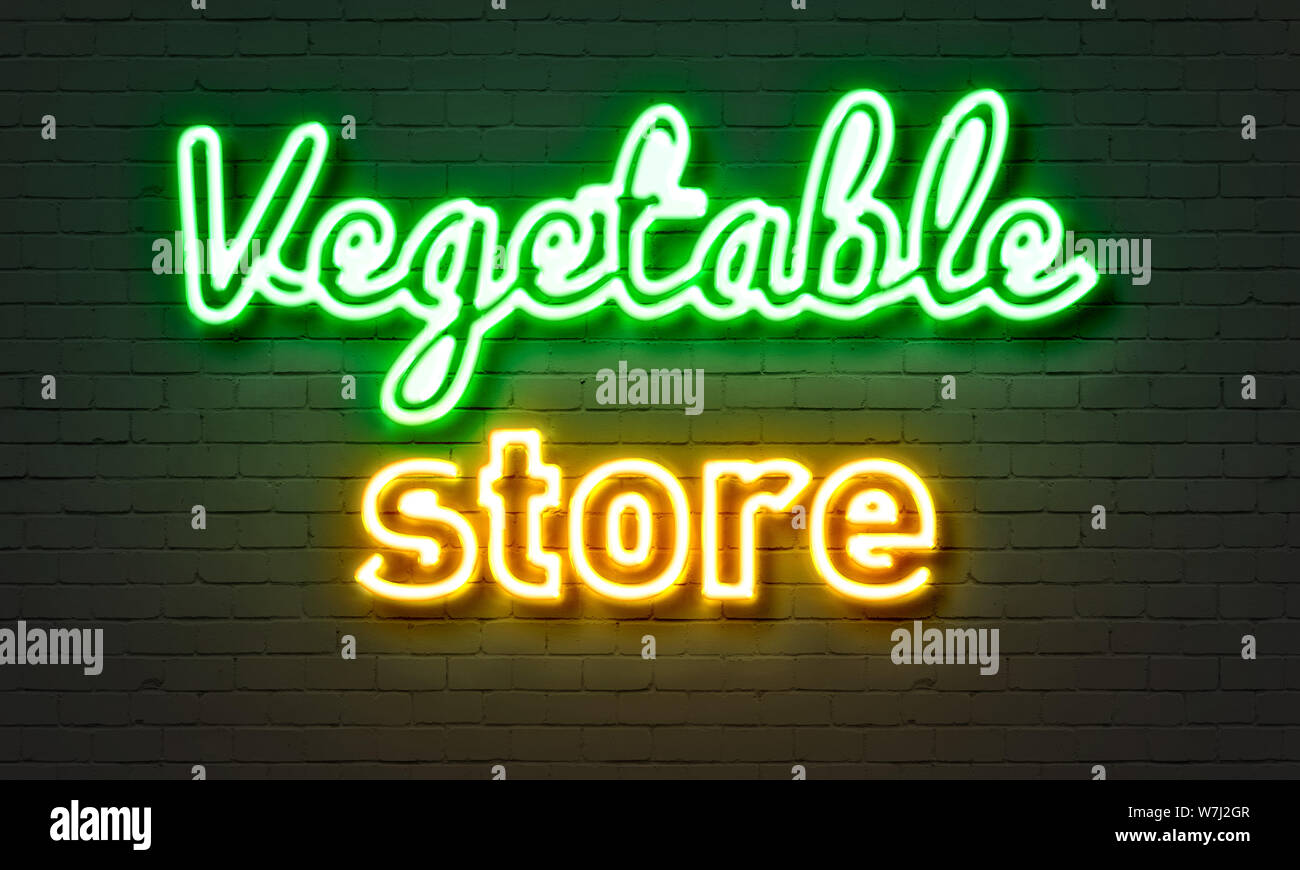 Vegetable store neon sign on brick wall background Stock Photo - Alamy