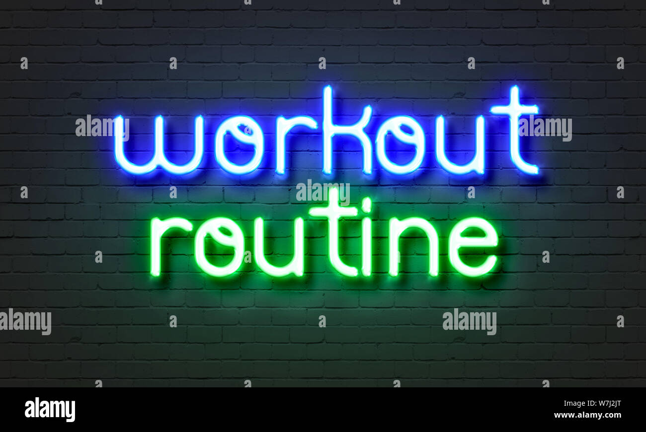 Workout routine neon sign on brick wall background Stock Photo - Alamy