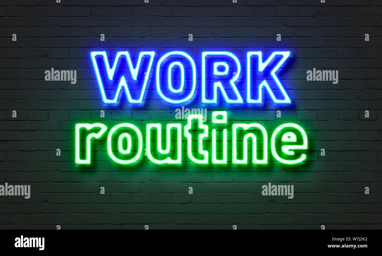 Work routine neon sign on brick wall background Stock Photo - Alamy